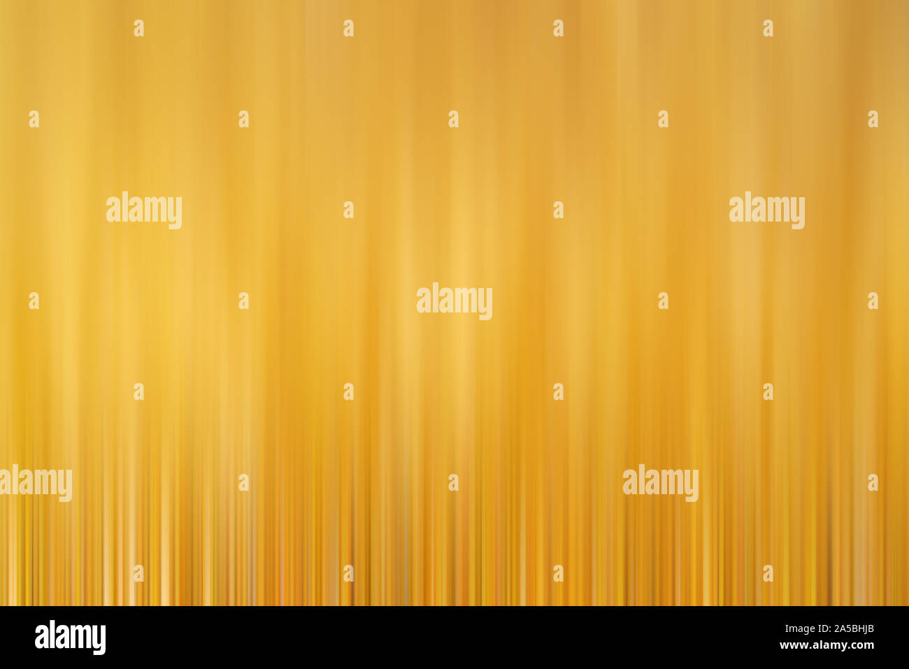 Abstract vertical yellow lines background. Streaks are blurry in motion ...