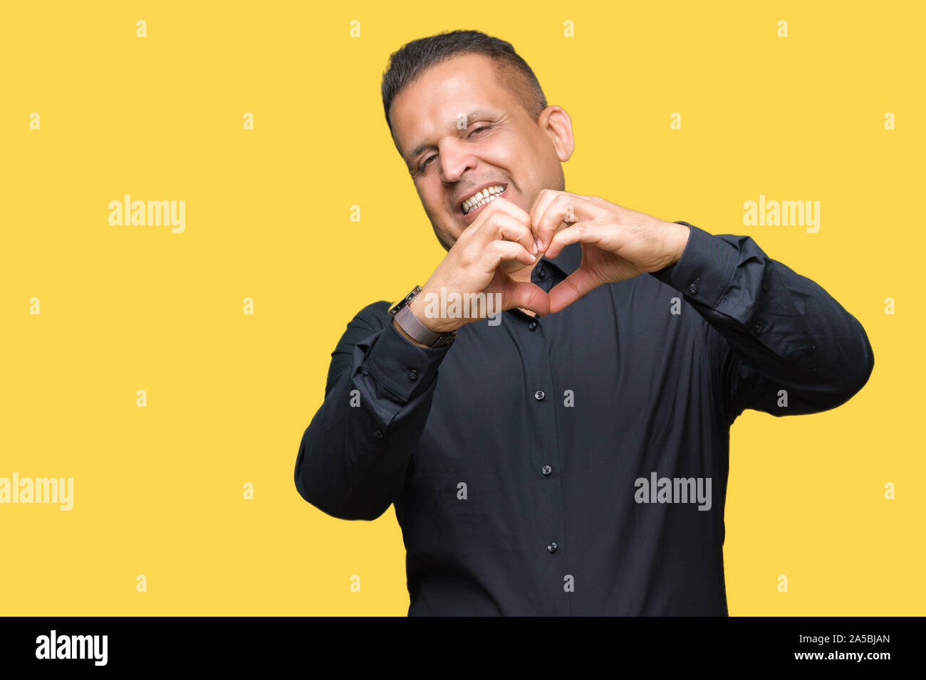 Handsome middle age arab business man over isolated background smiling ...