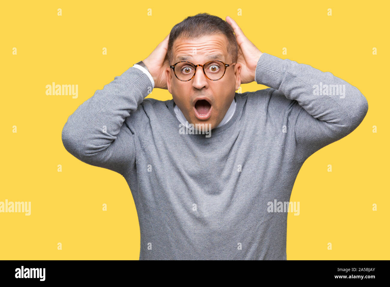 Old man looking shocked hands on head hi-res stock photography and ...