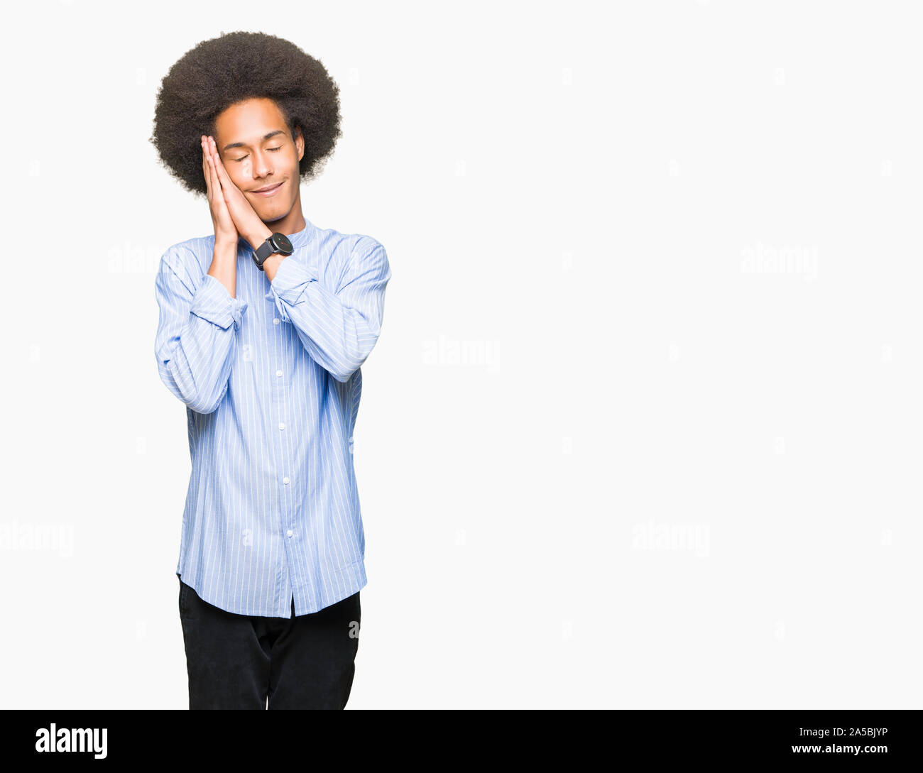 Young african american man with afro hair sleeping tired dreaming and ...
