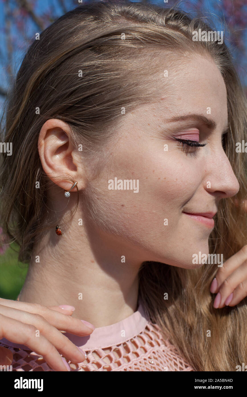 ladybug on a woman's neck Ladybird insects Stock Photo - Alamy