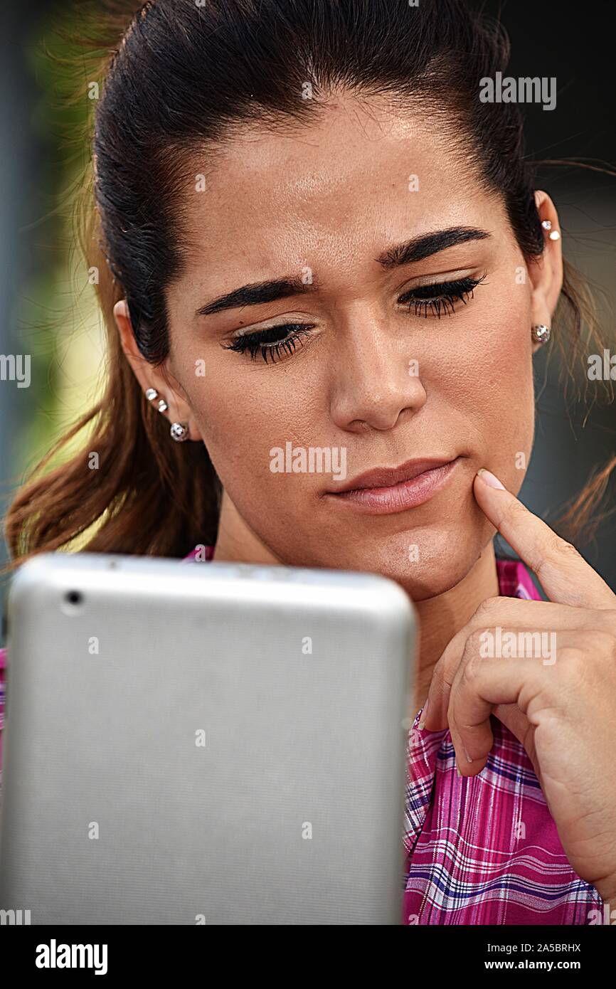 Women thinking gadget hi-res stock photography and images - Alamy
