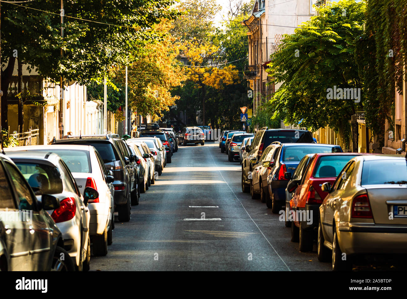 Cars parked on both sides of the road in Bucharest, Romania, 2019 Stock ...