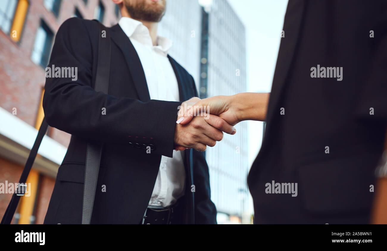 Handshake business. Businessman and business woman make handshakes ...