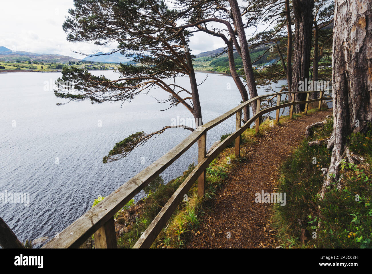 Hiking the dirt path walking track around The Lump, a hilly peninsula ...