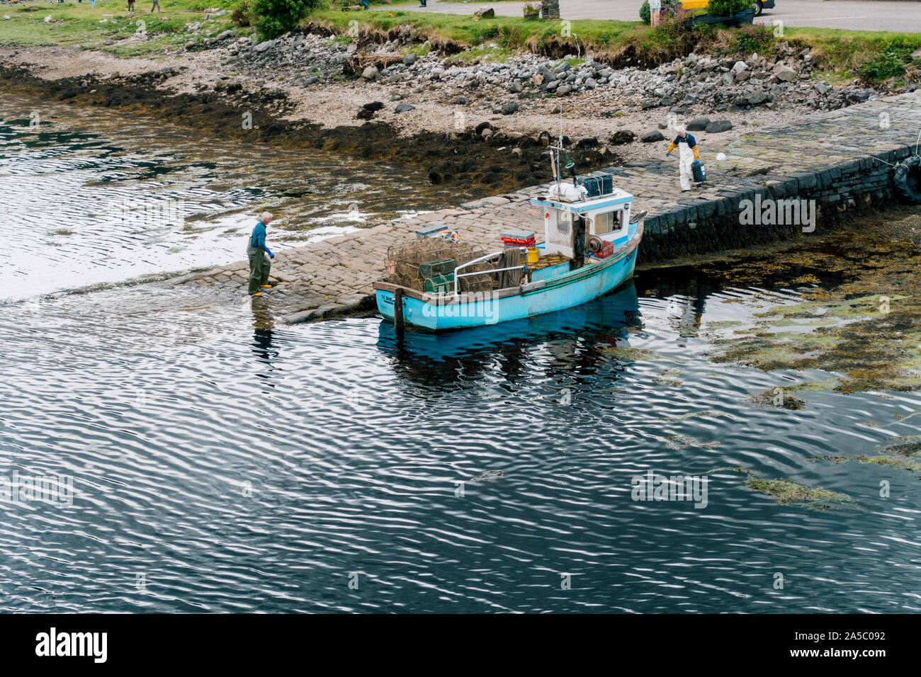 A husband and wife couple return from a days fishing around the Isle of ...