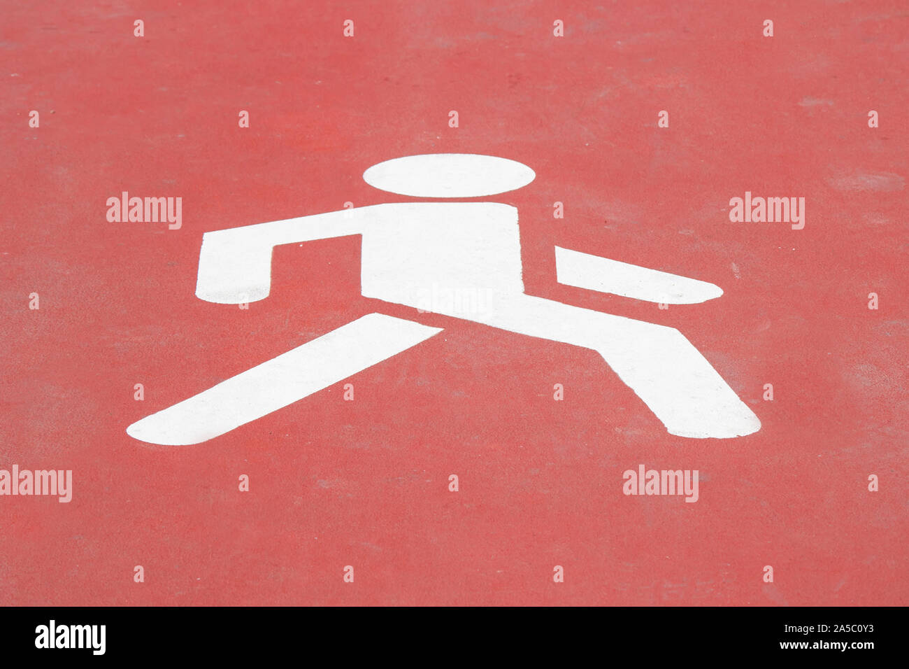 Walk way sign painted on the floor. Human icon walking on red ...