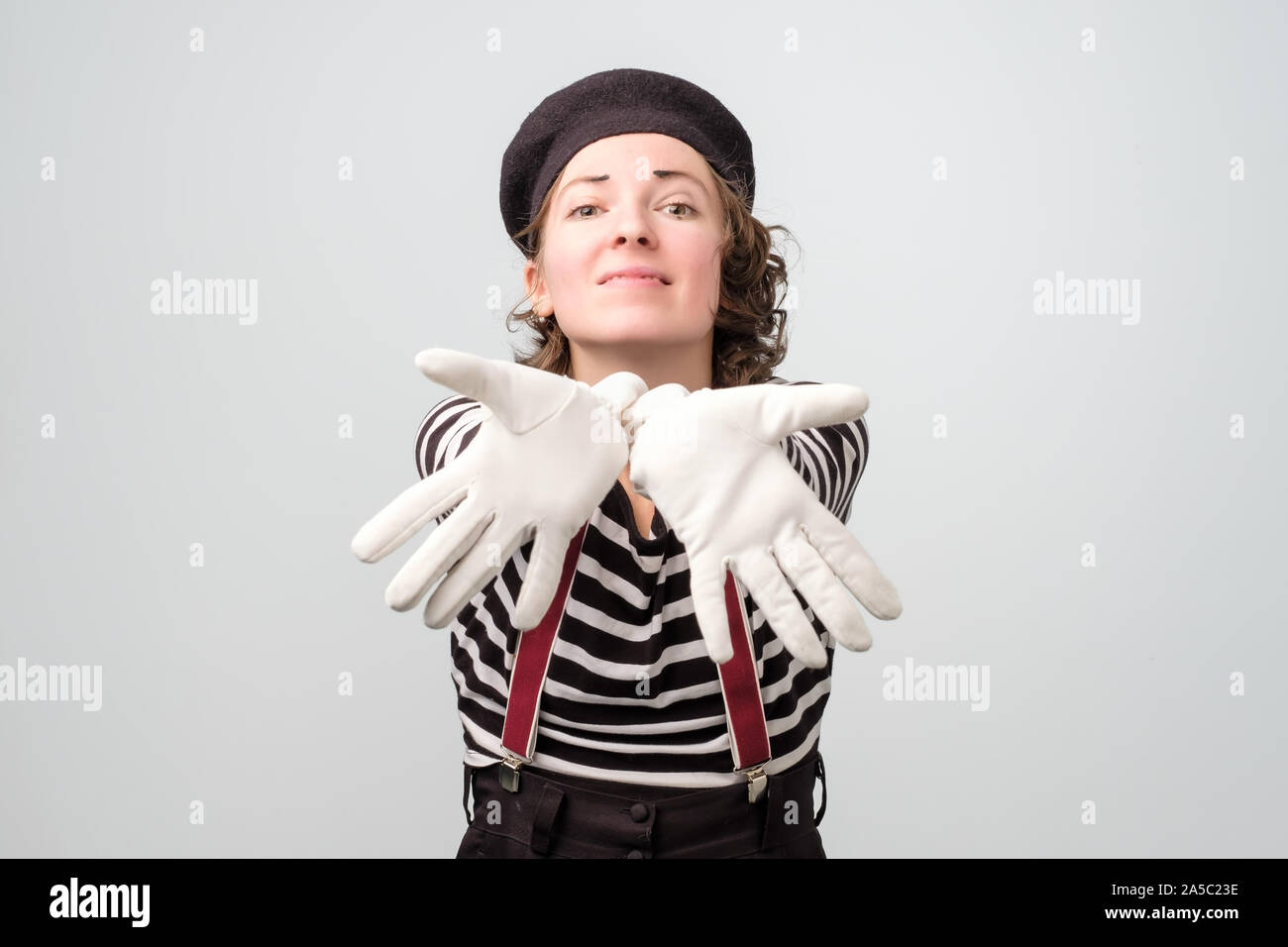 Young woman offering or giving something to you Stock Photo - Alamy