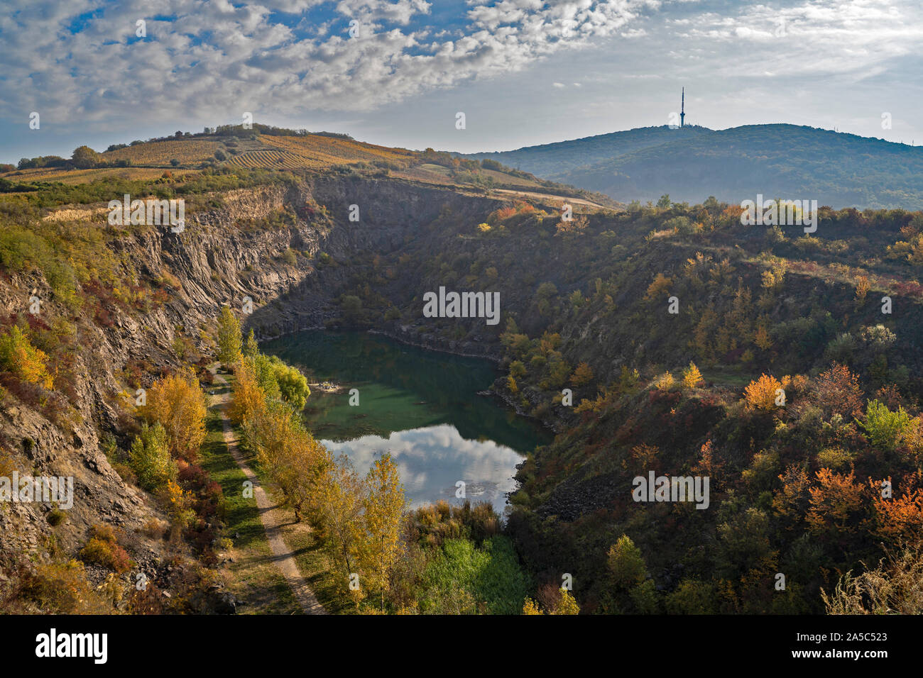 Aerial photo of a lake/quarry pond in the mountains. Abandoned mine at ...