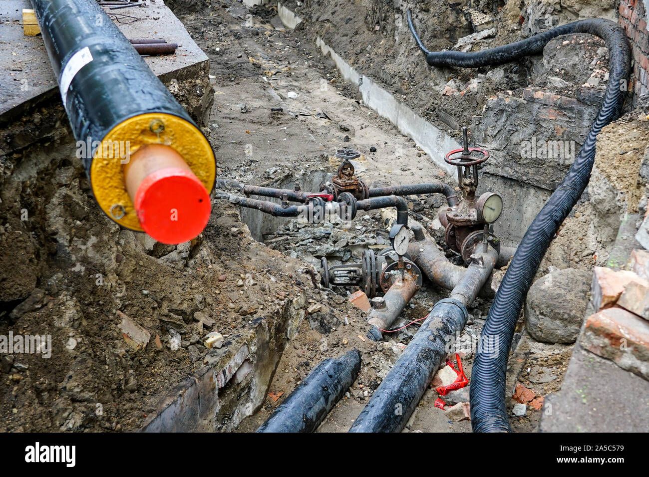 underground heating system pipes replacement on the city street Stock ...
