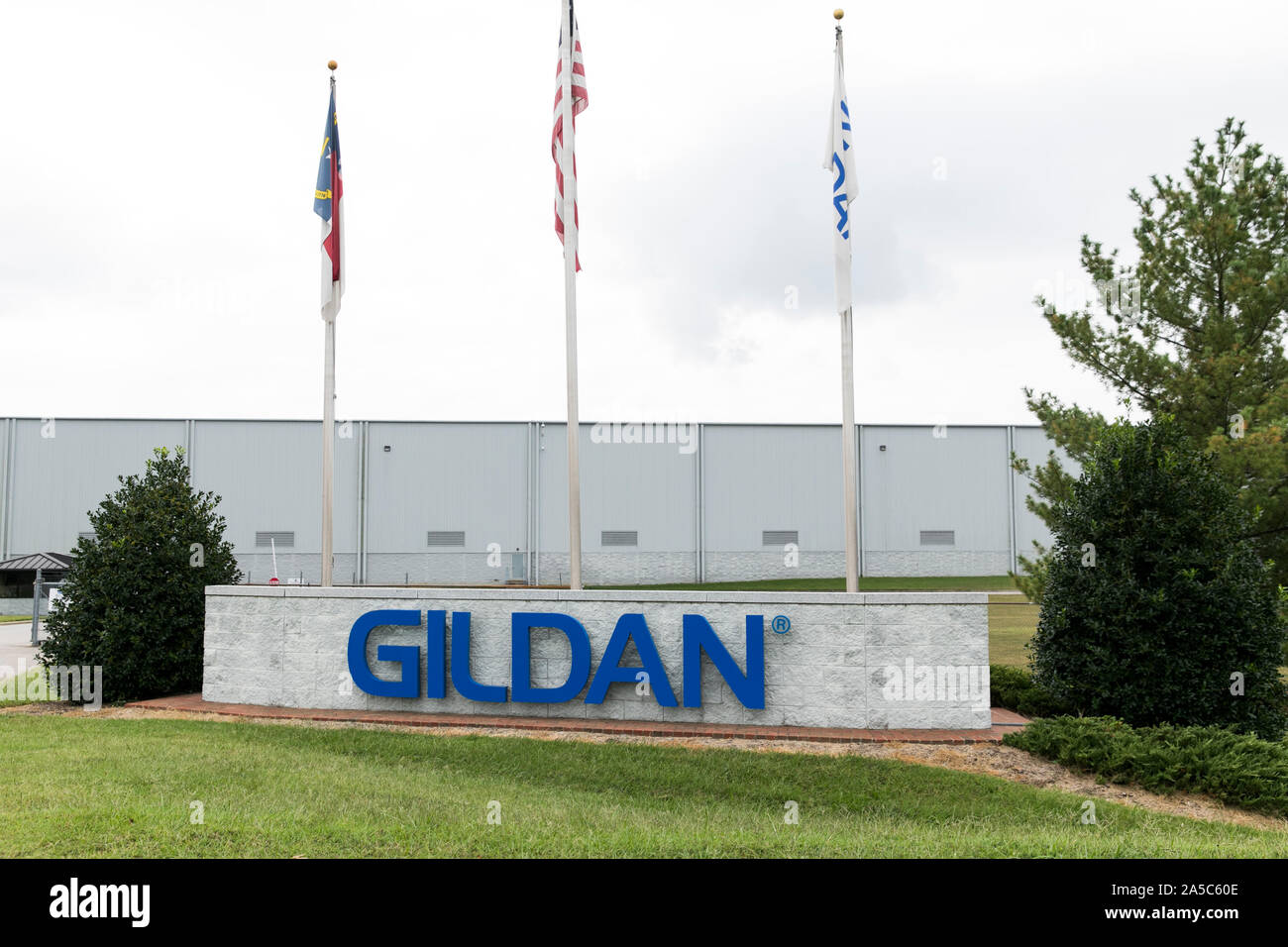 A logo sign outside of a facility occupied by Gildan in Eden, North ...