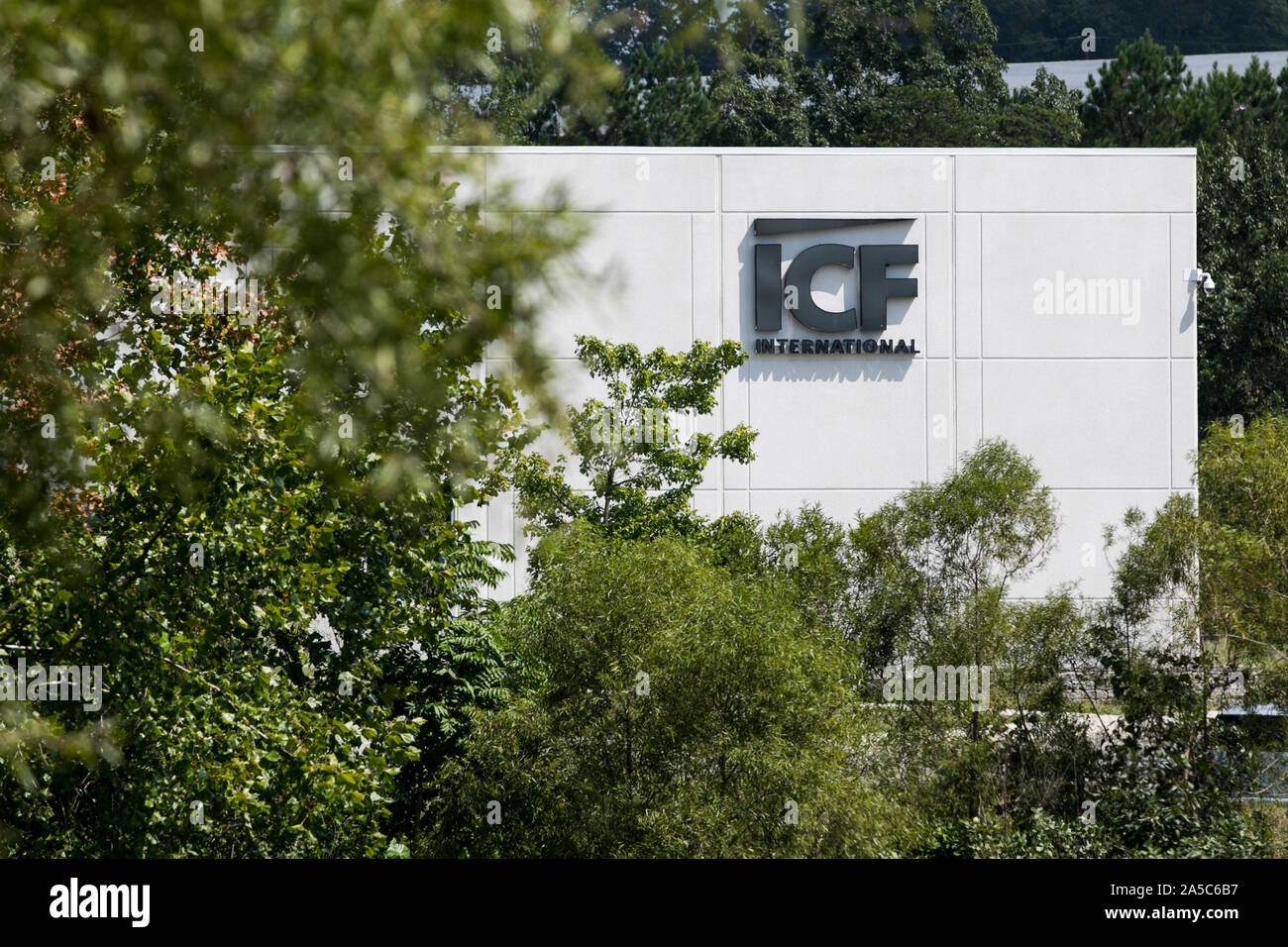 A logo sign outside of a facility occupied by ICF International in ...