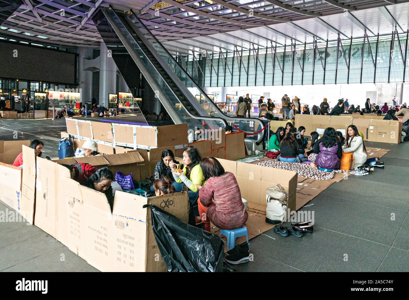 Filipino domestic workers gather on their day-off under the Hong Kong ...