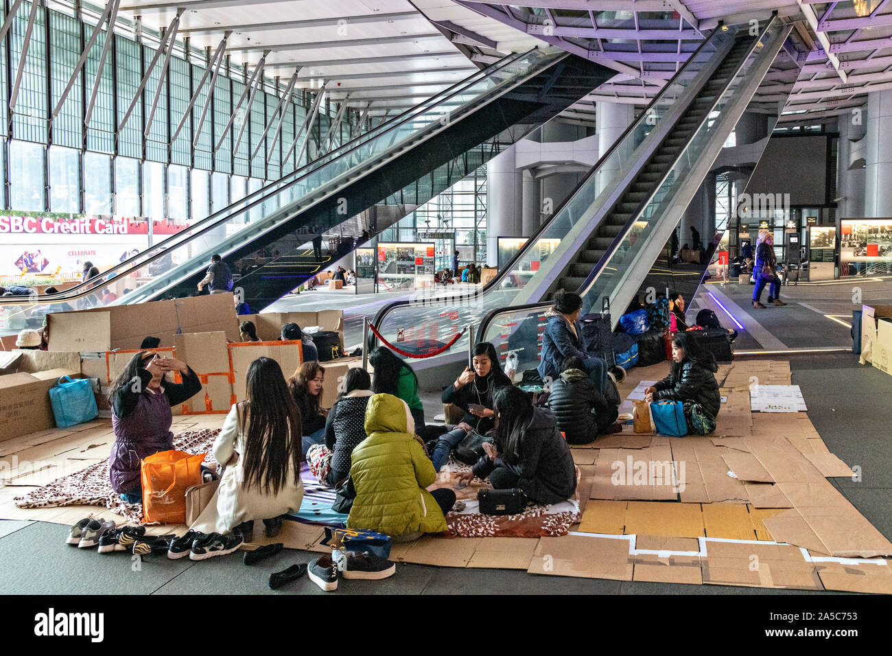 Filipino domestic workers gather on their day-off under the Hong Kong ...