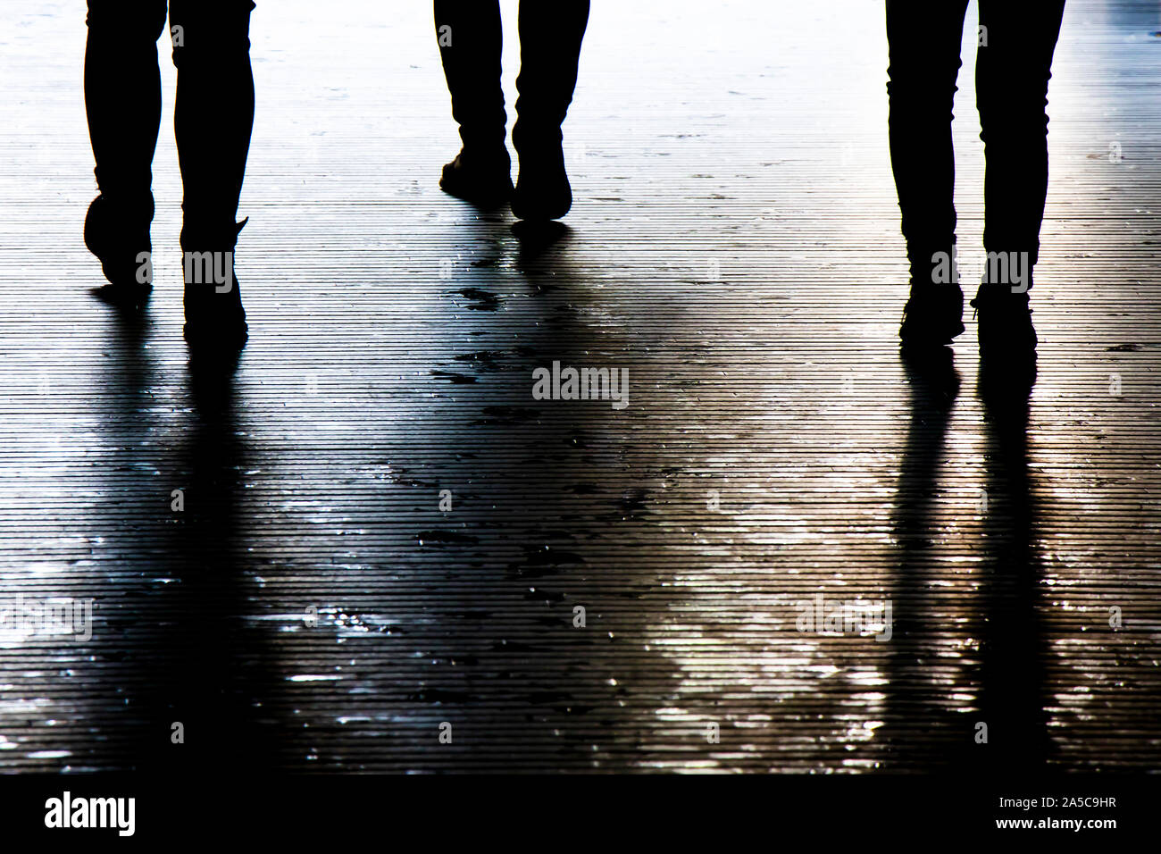 Blurry shadow silhouette of a people walking in the night, detail of ...