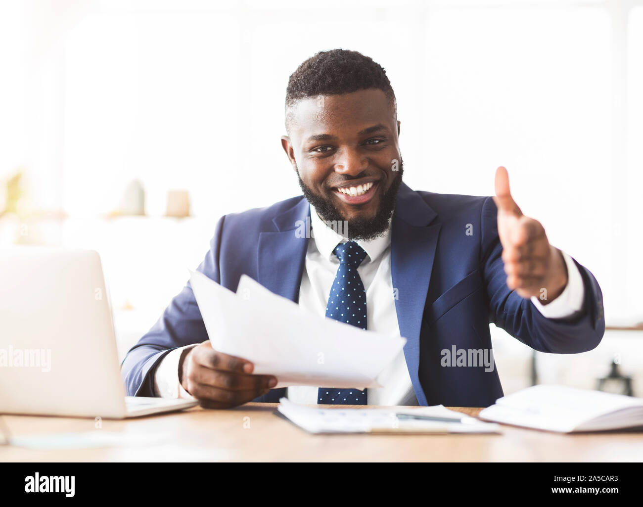 Businessman extending hand hi-res stock photography and images - Alamy