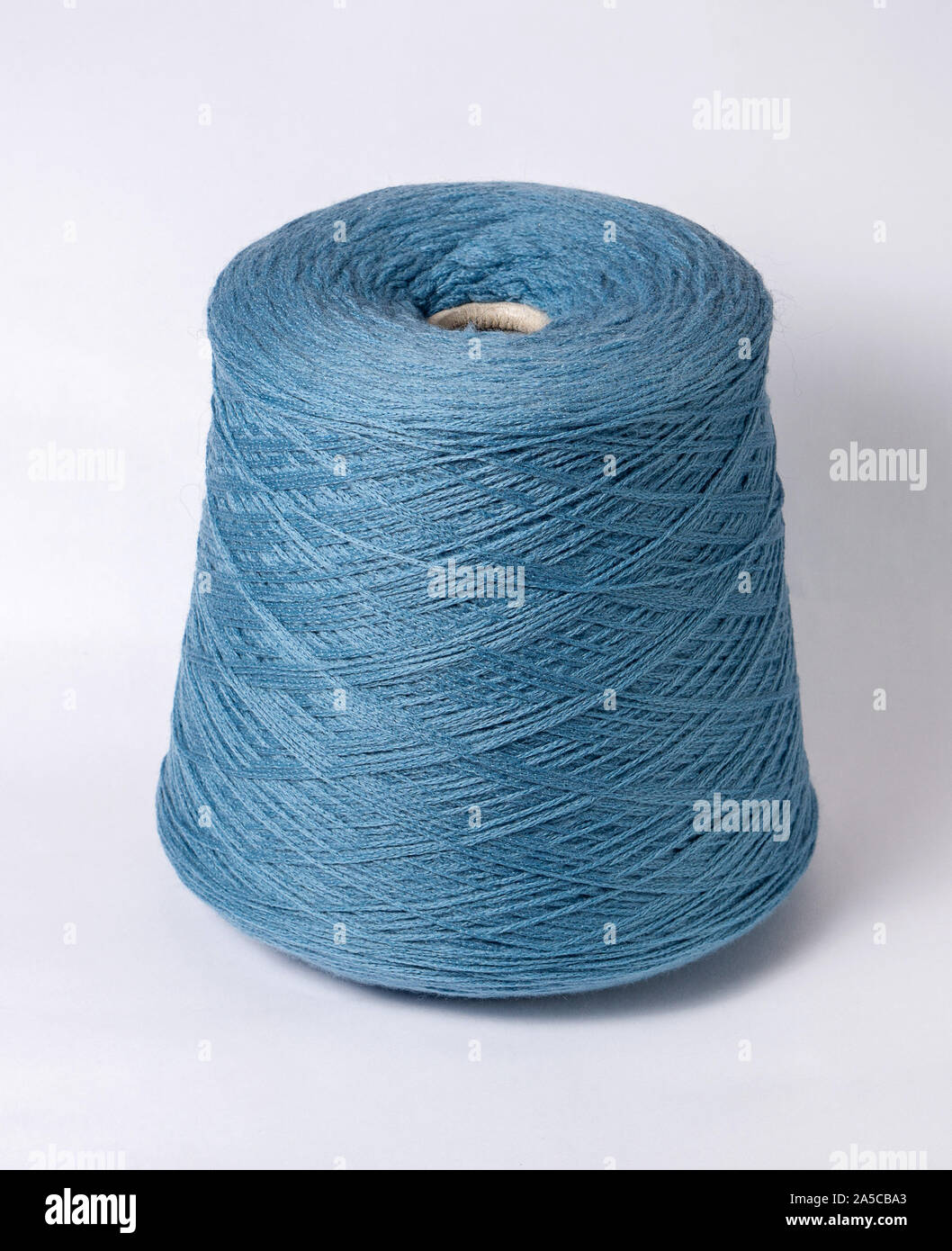 bobbin of yarn on a white background. Side view.Textile reel on ...