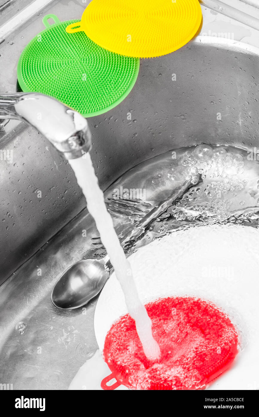 Washing the dishes on the kitchen sink Stock Photo - Alamy