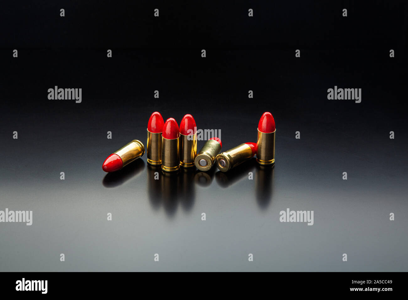 Bullet isolated on black background with reflexion. Rifle bullets close ...
