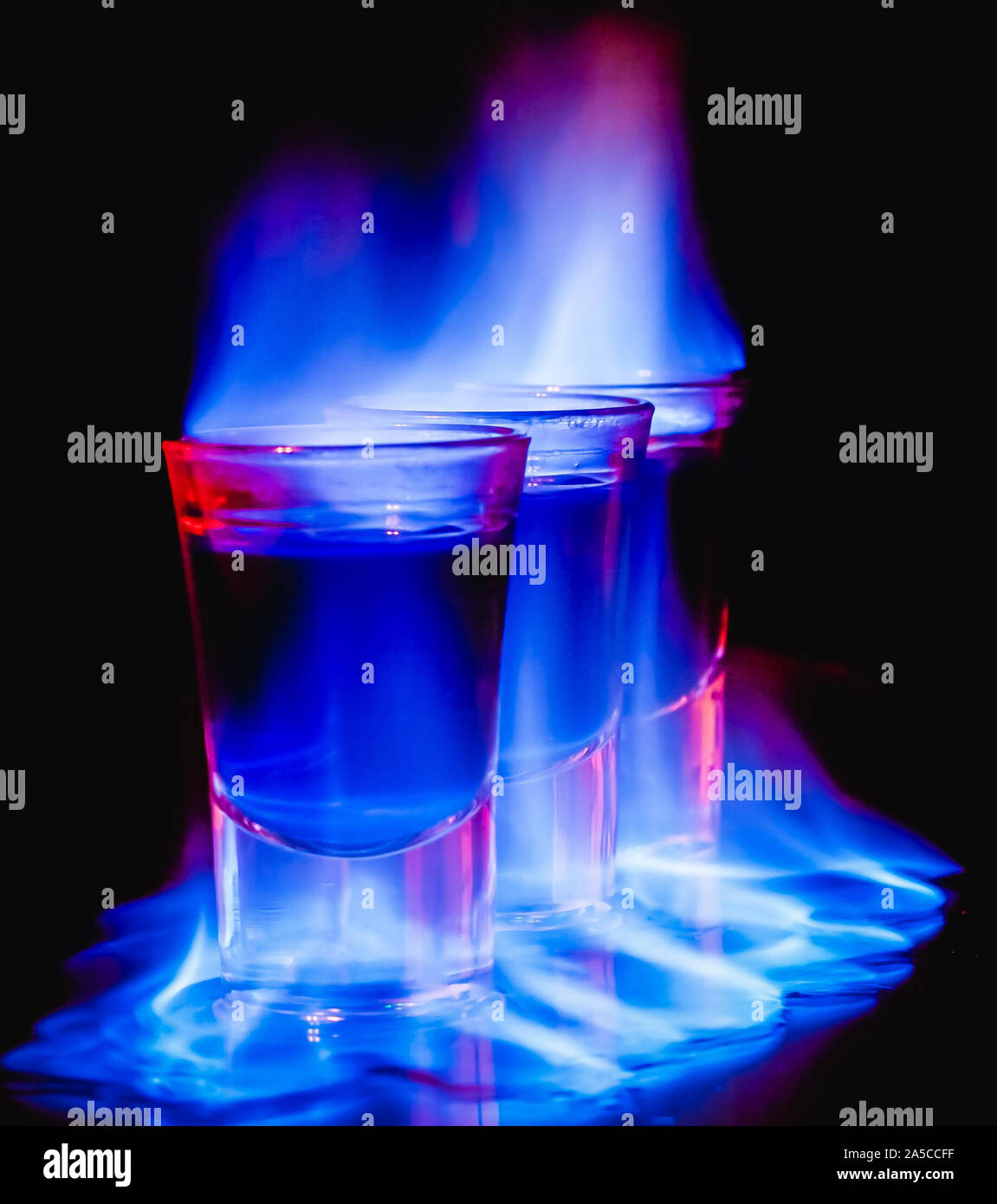 burning drink in shot glass Stock Photo - Alamy