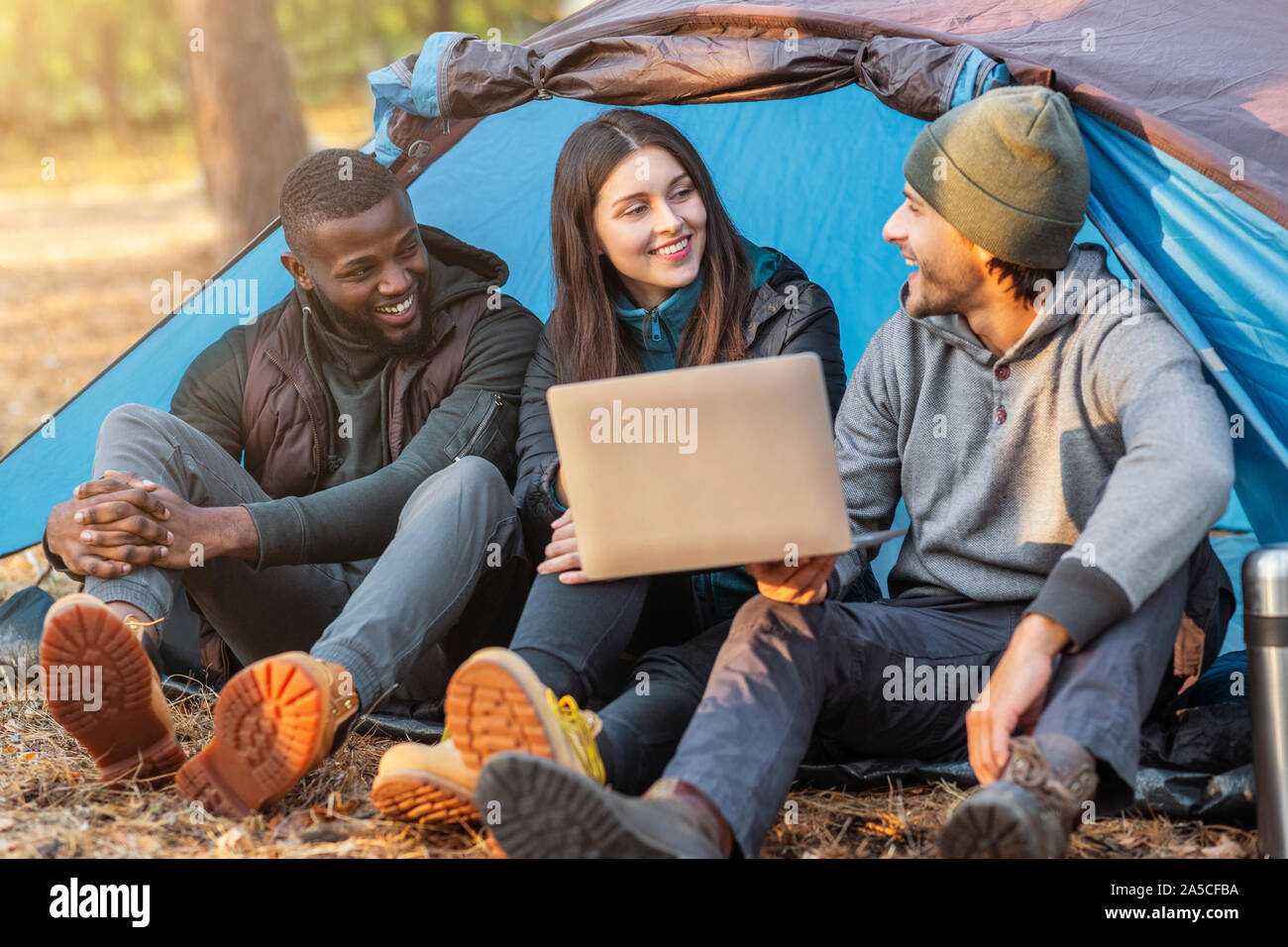 Man using laptop computer camping hi-res stock photography and images ...
