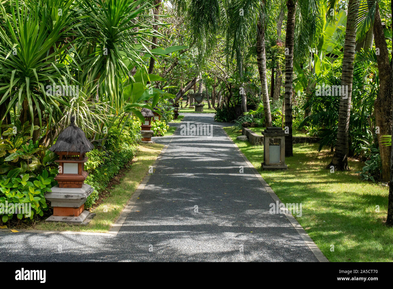 Pathway through the landscaped gardens of a tropical resort in Bali ...