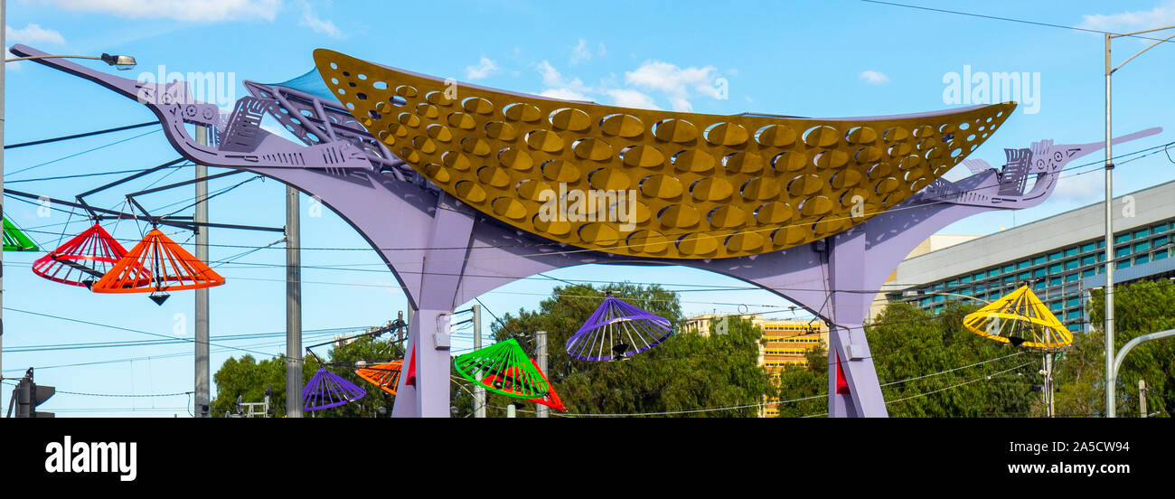 Gateway and streetlights of colourful metal conical hats homage to ...