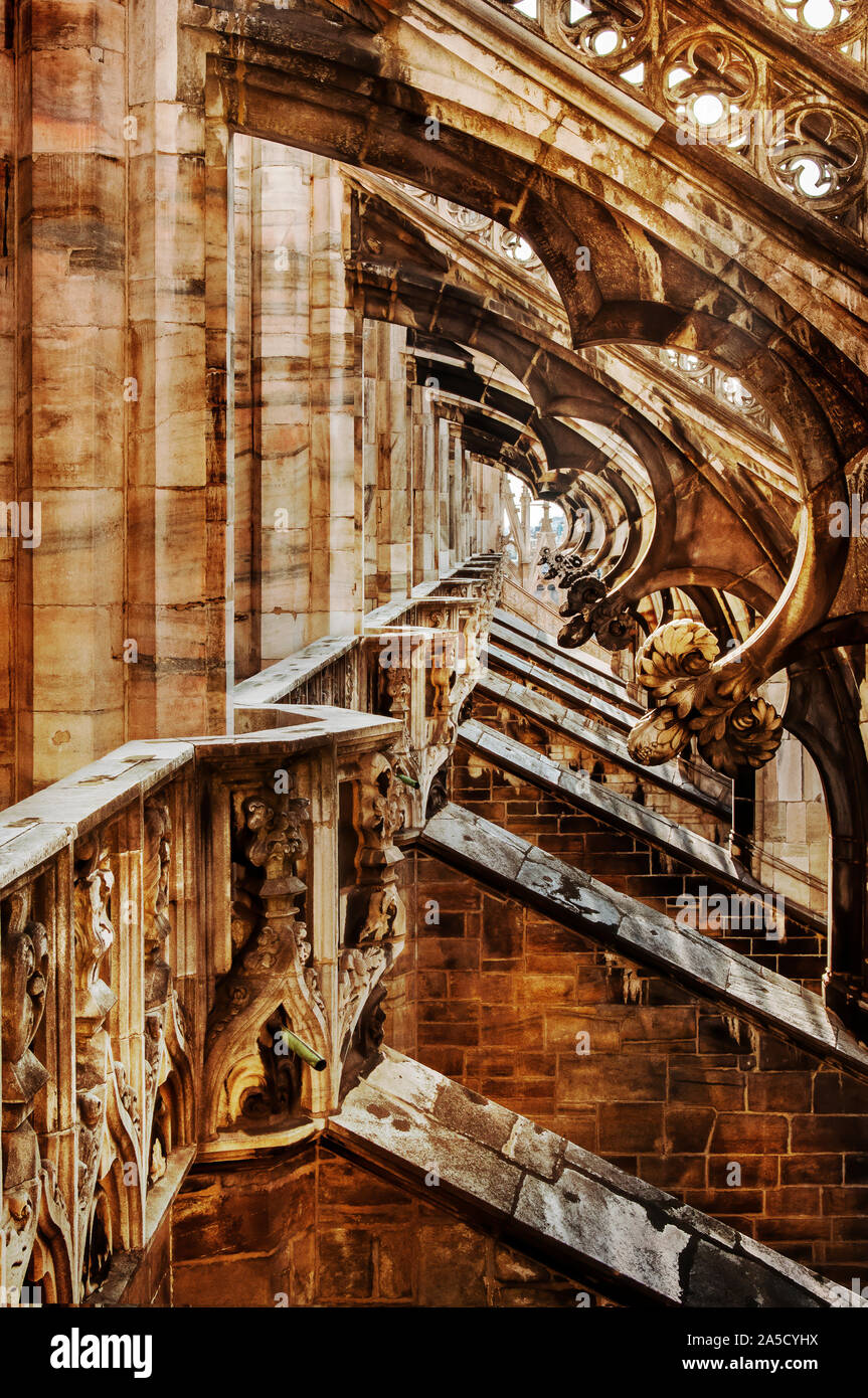 The flying buttresses support the walls of Milan Duomo, the significant ...