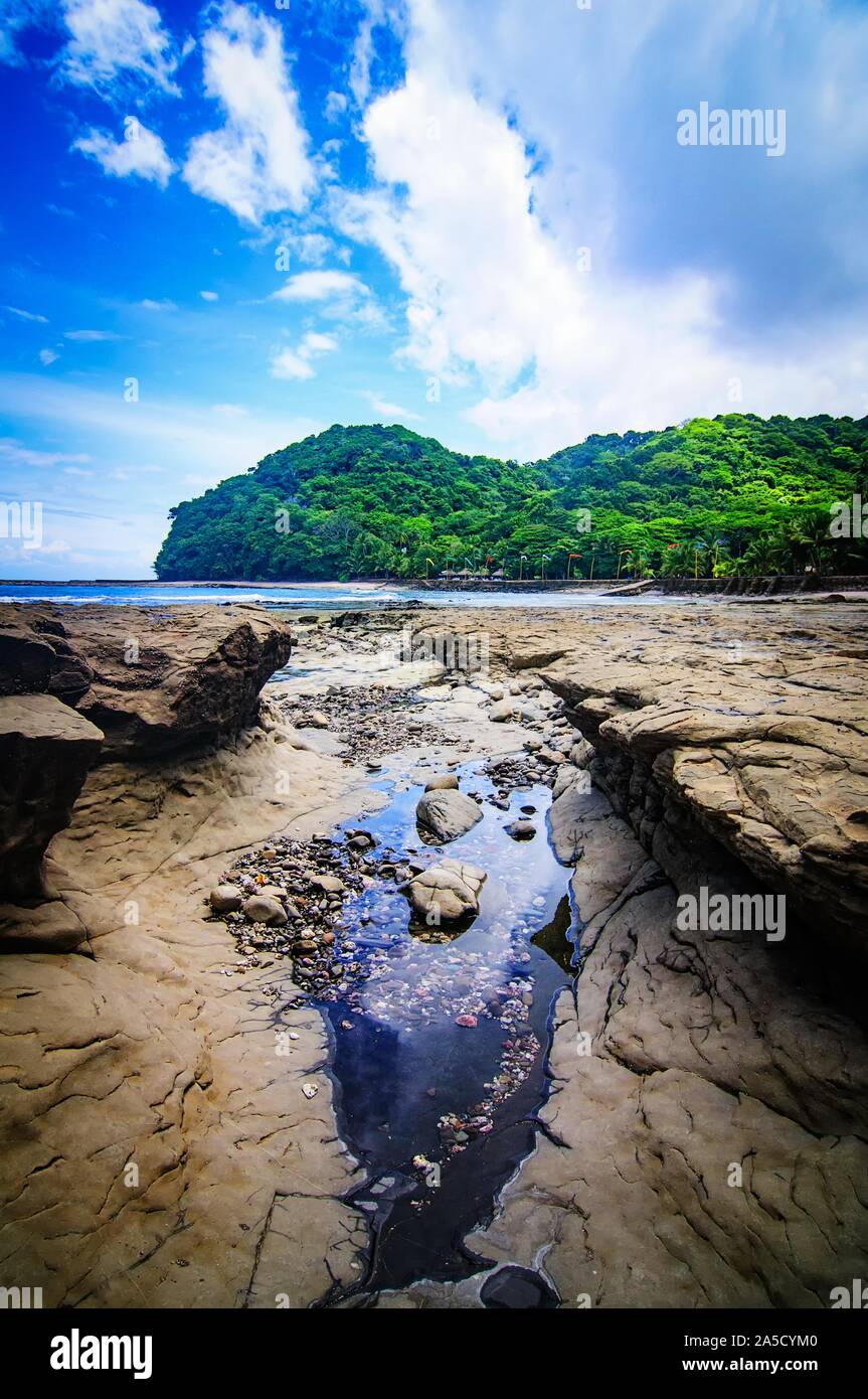 Vertical shot of a ground cut in two parts and with water in the middle ...
