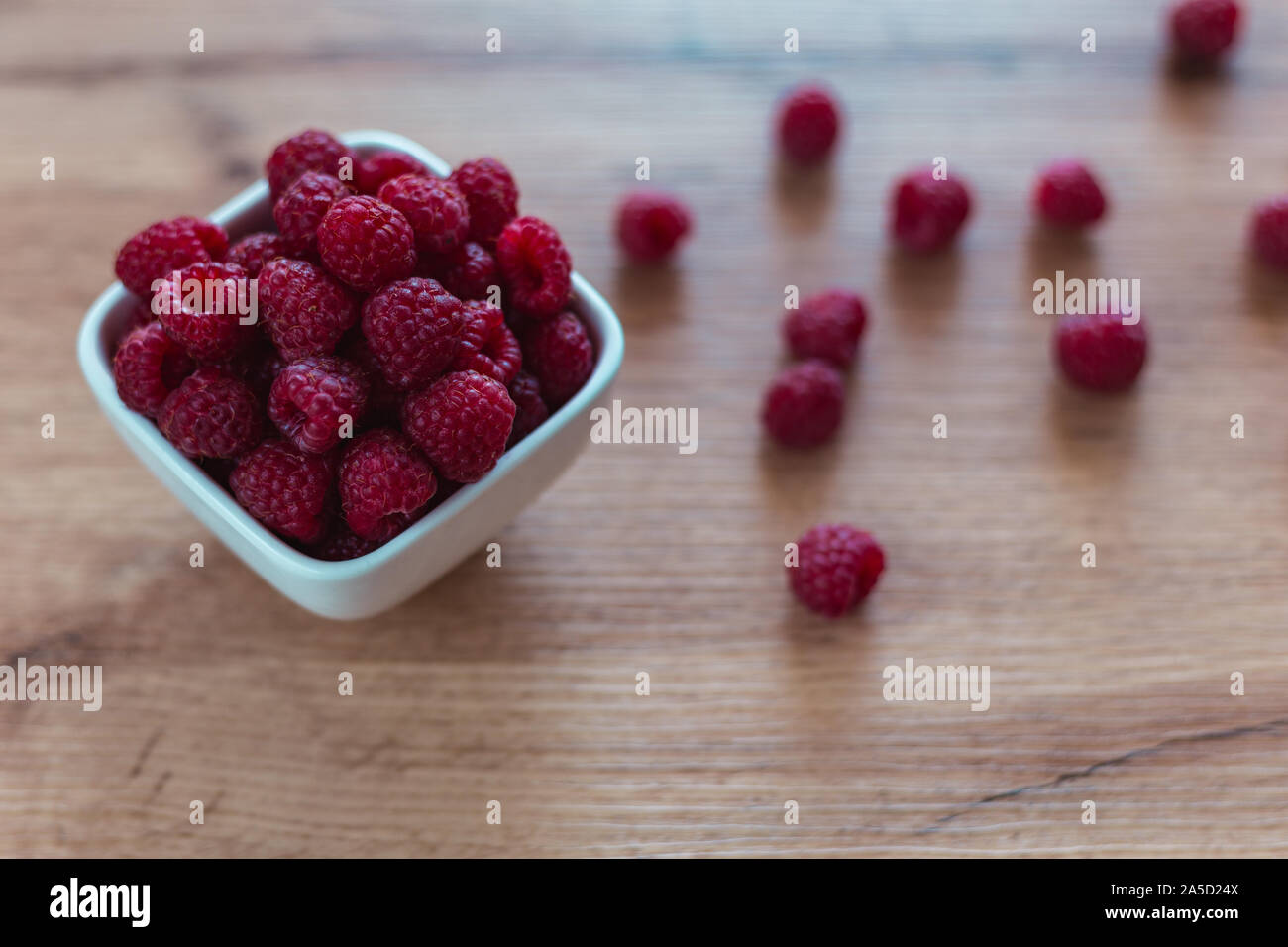Raspberries in a white bowl hi-res stock photography and images - Alamy