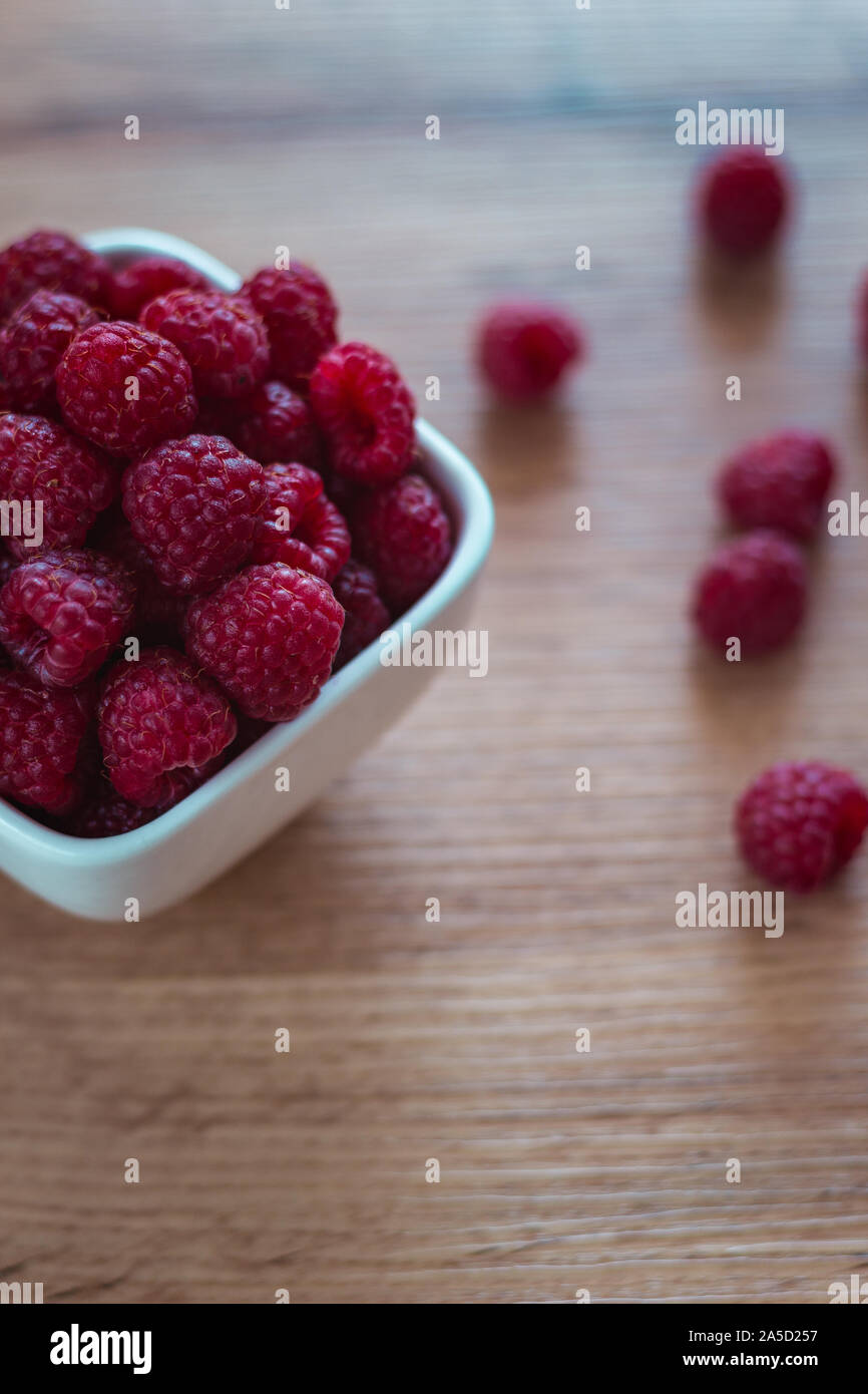 Raspberries in a white bowl hi-res stock photography and images - Alamy
