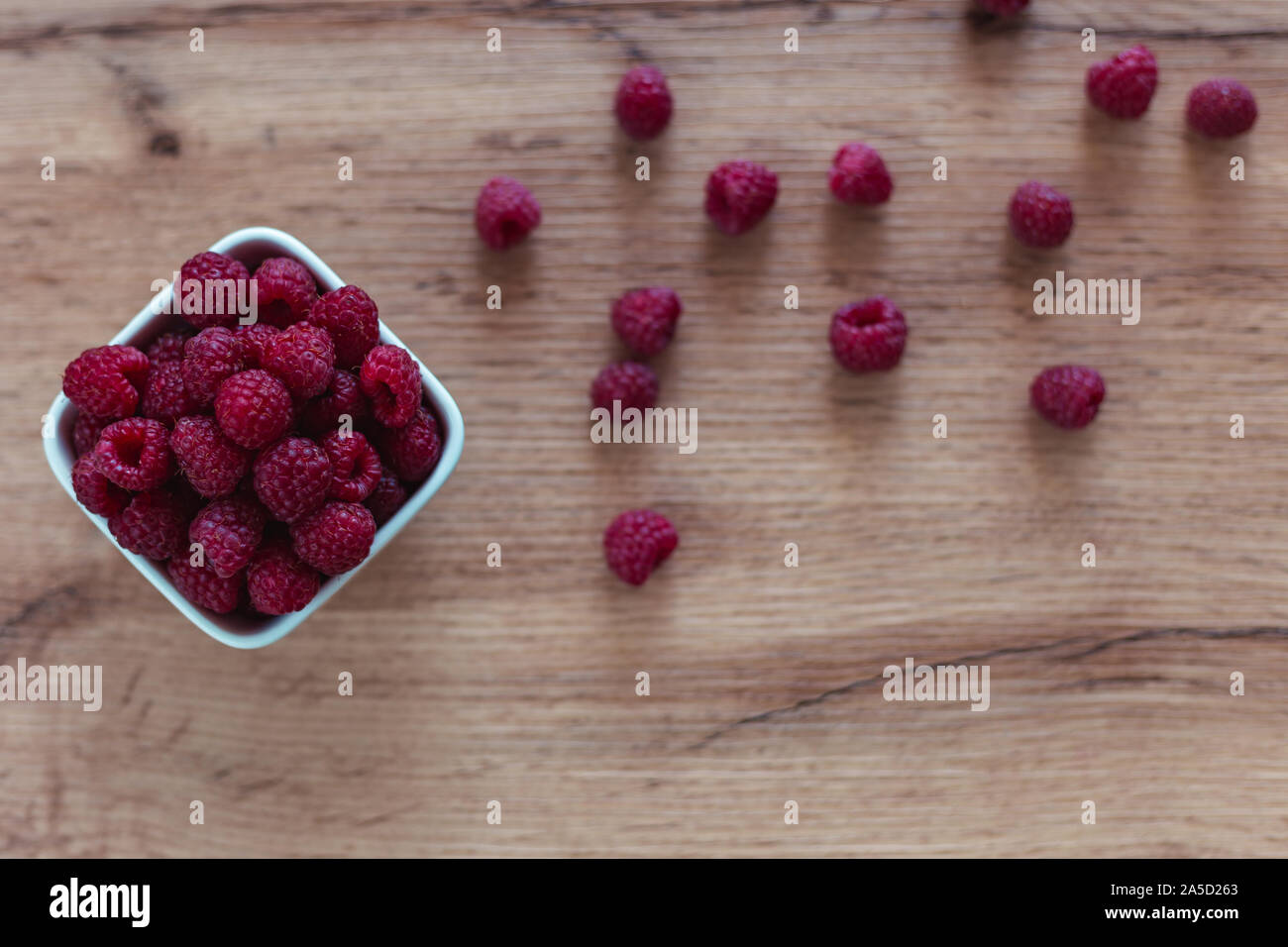 Fresh raspberry in bowl hi-res stock photography and images - Alamy