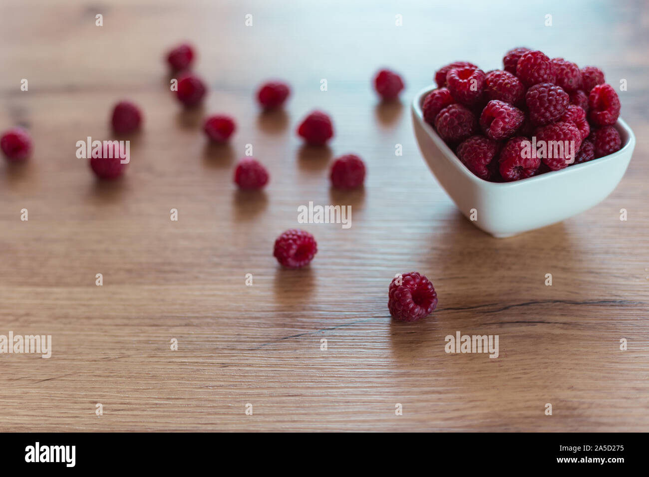 Fresh raspberry in bowl hi-res stock photography and images - Alamy
