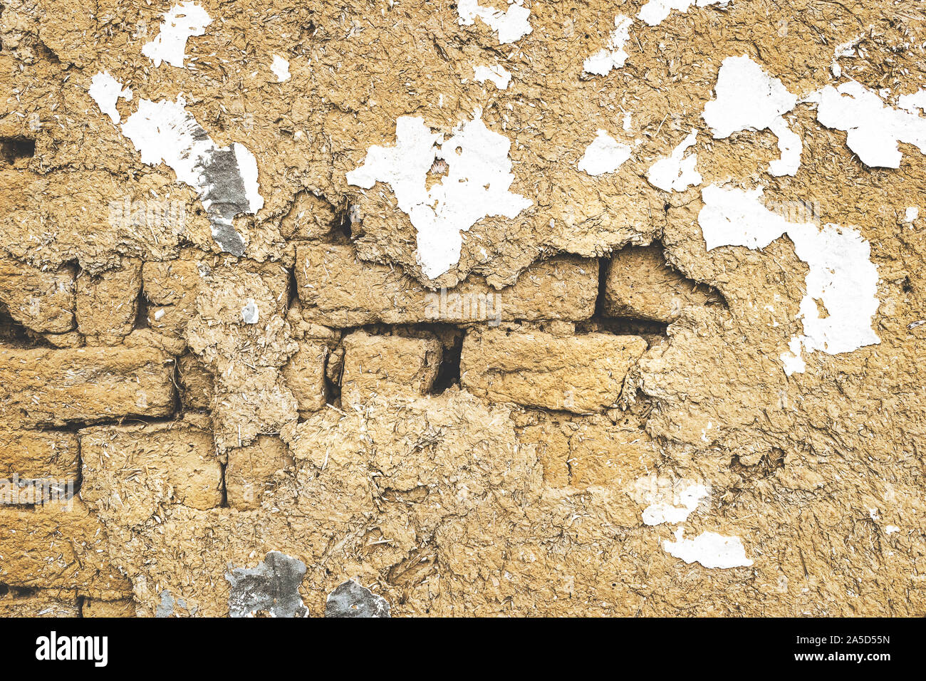Dirty old rotten plaster on a wall texture. White paint resign and ...