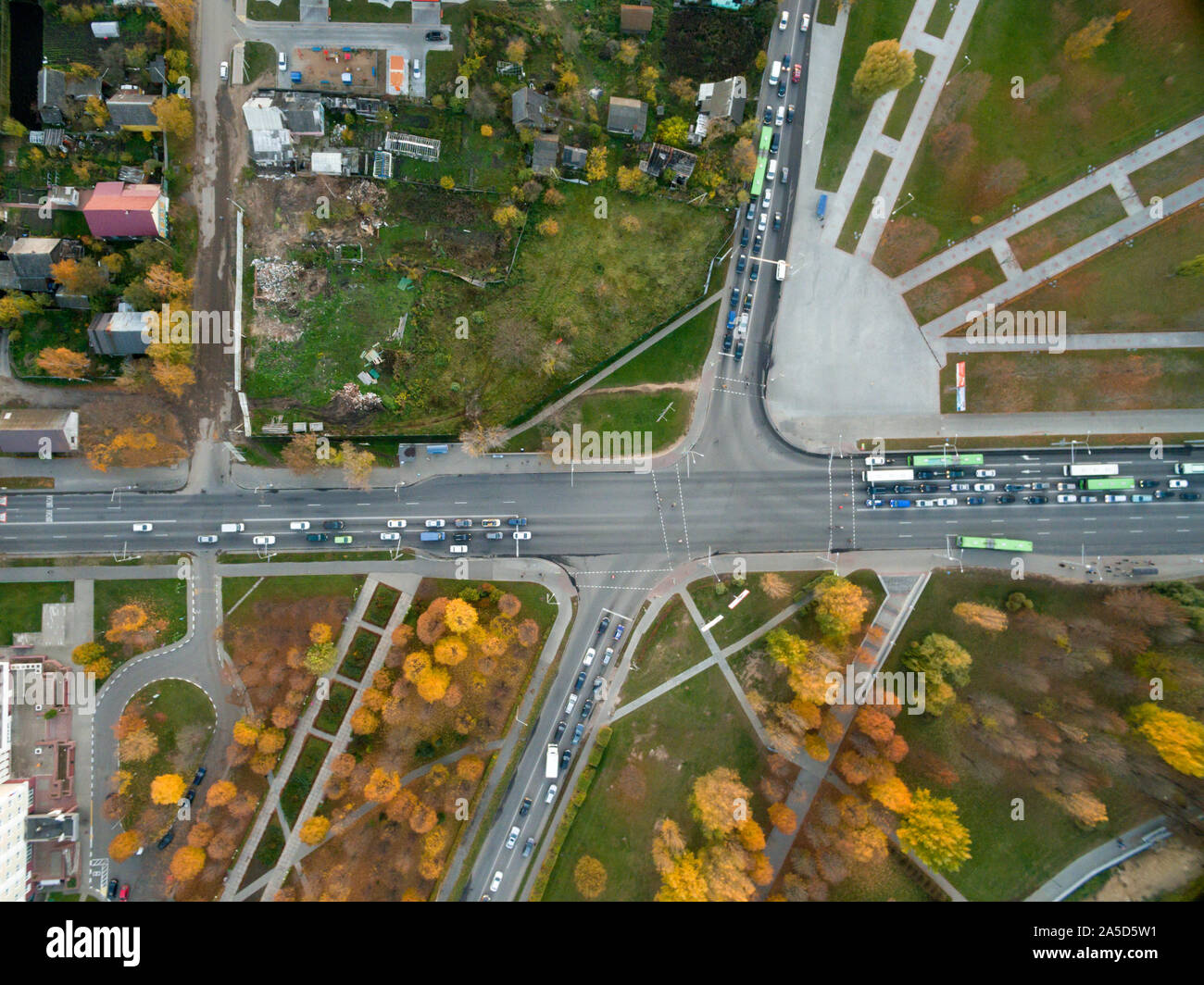 Aerial view to the city crossroads with a car and traffic lights. Urban ...