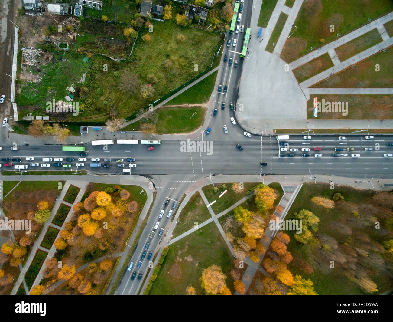 Aerial view to the city crossroads with a car and traffic lights. Urban ...