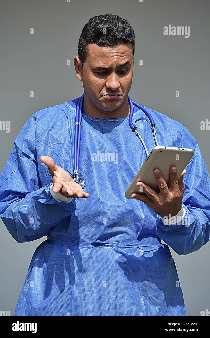 Confused Male Doctor With Tablet Stock Photo - Alamy