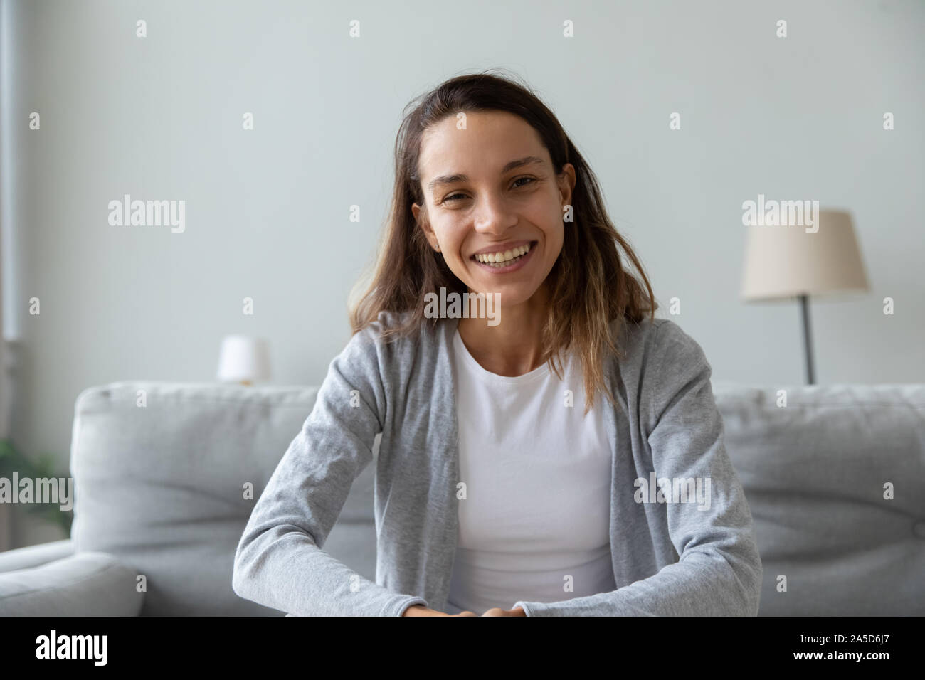 Web camera portrait of happy smiling mixed race young woman Stock Photo ...
