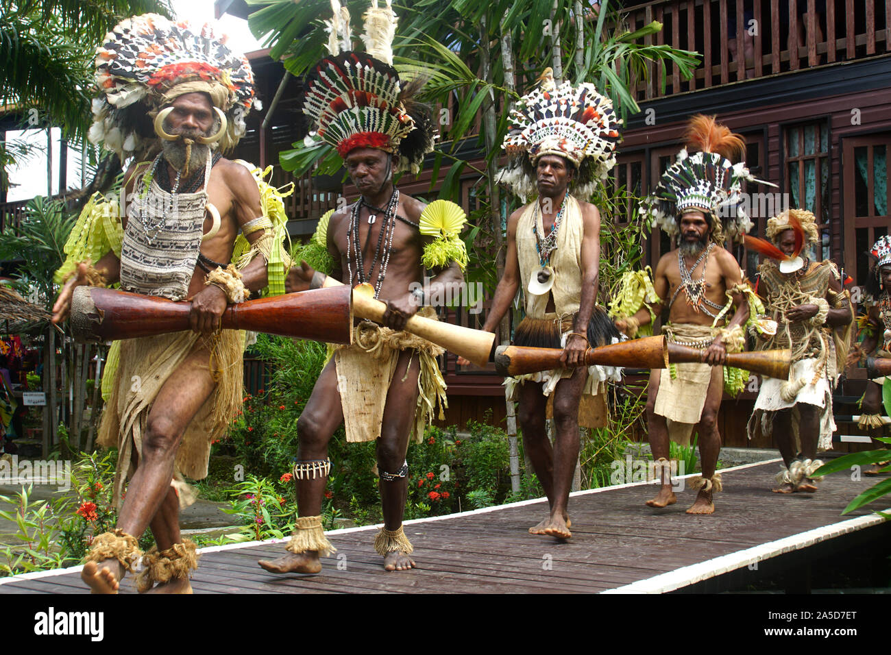 Row of Traditionally Dressed Men with Kundu Drums Stock Photo - Alamy
