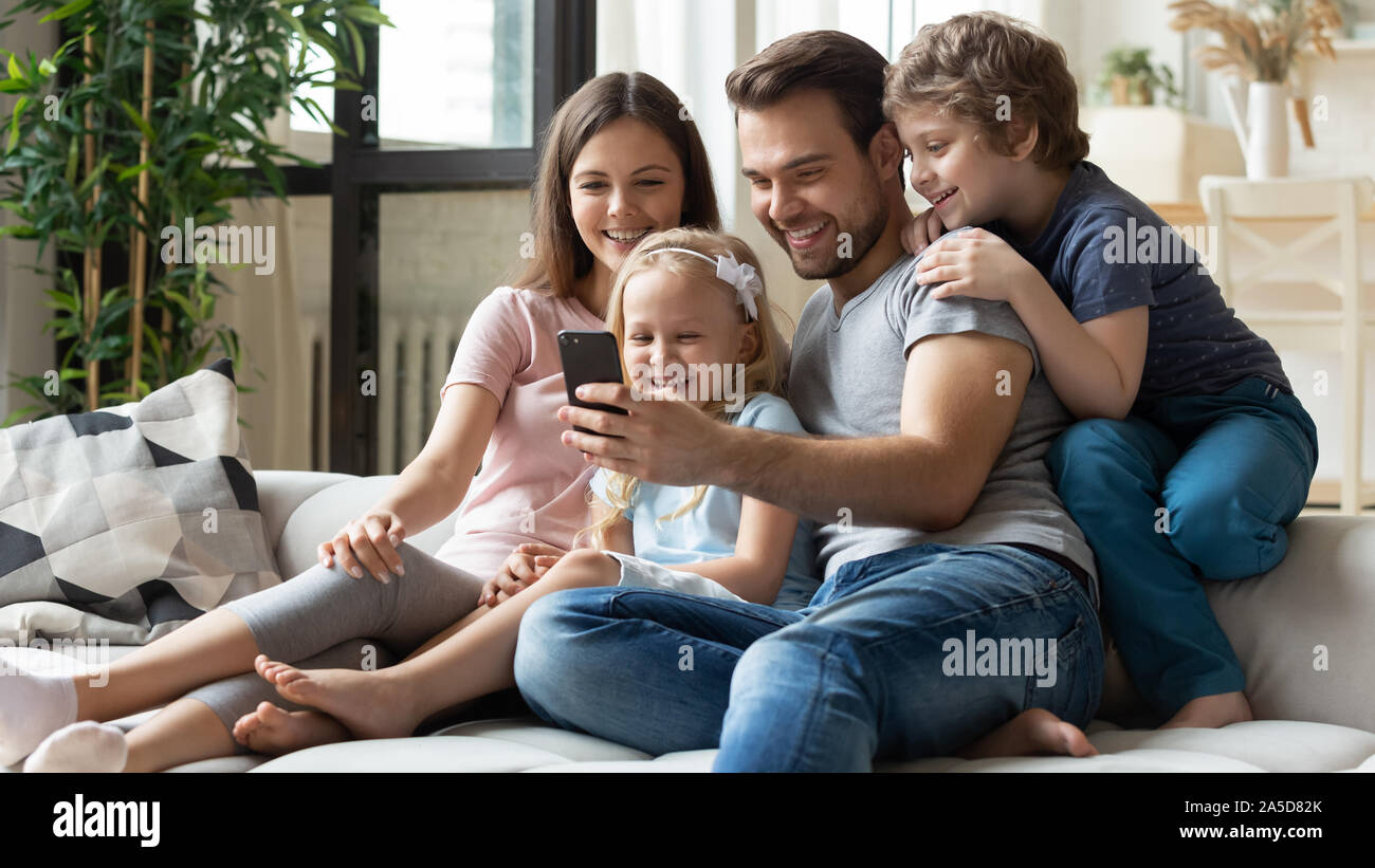 Children using phone hi-res stock photography and images - Alamy