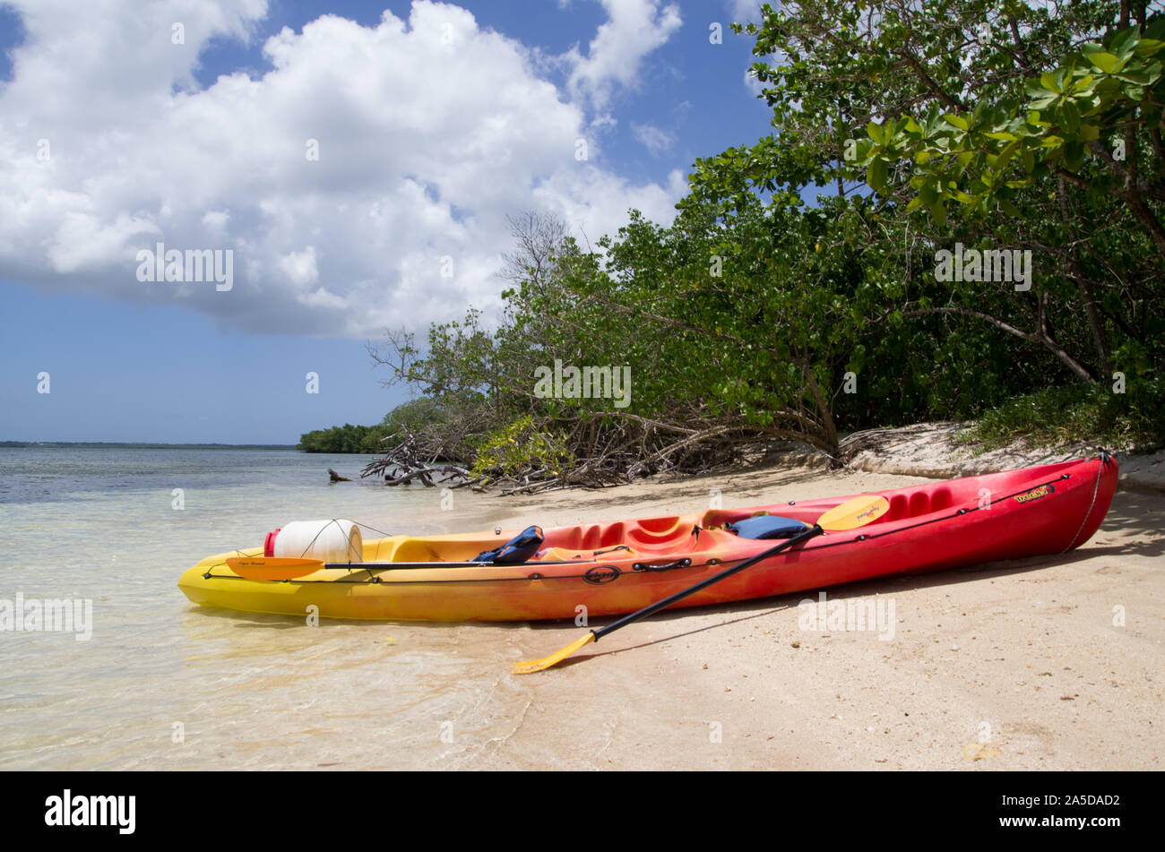 canoe kayak red and yellow gaudeloupe beach sky blue Stock Photo - Alamy