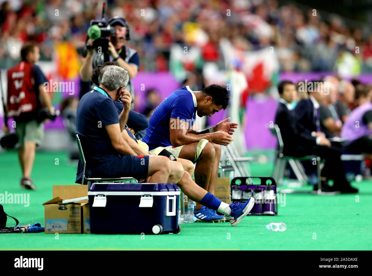 France's Sebastien Vahaamahina sits out after receiving a red card ...