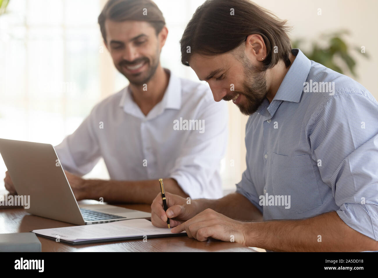 Happy businessman customer sign contract employment agreement at ...