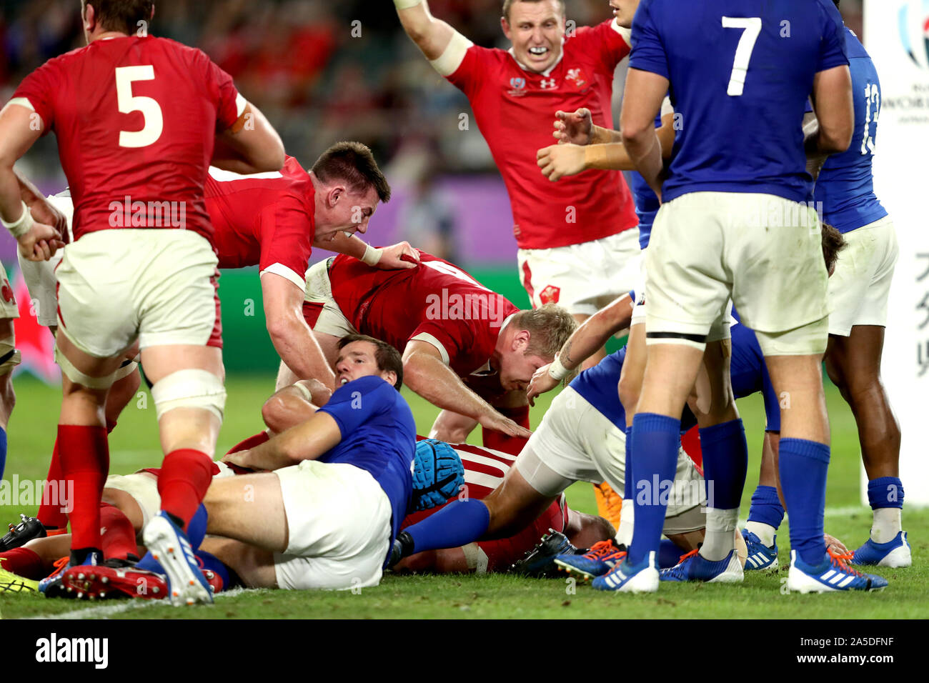 Wales' Ross Moriarty (bottom) scores his sides second try during the ...