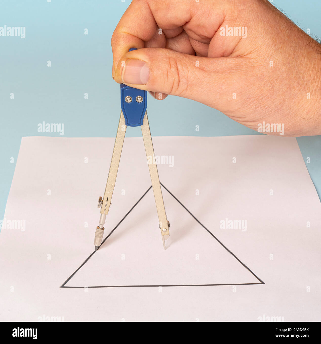 the improbable design of a triangle with a compass Stock Photo - Alamy