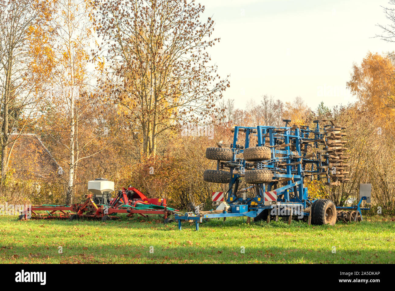Agricultural implements standing in a farm after summer season Stock ...