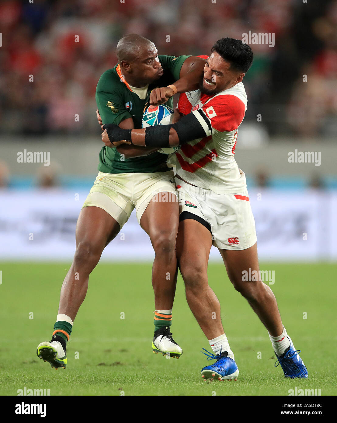 South Africa's Makazole Mapimpi (left) and Japan's Timothy Lafaele in ...