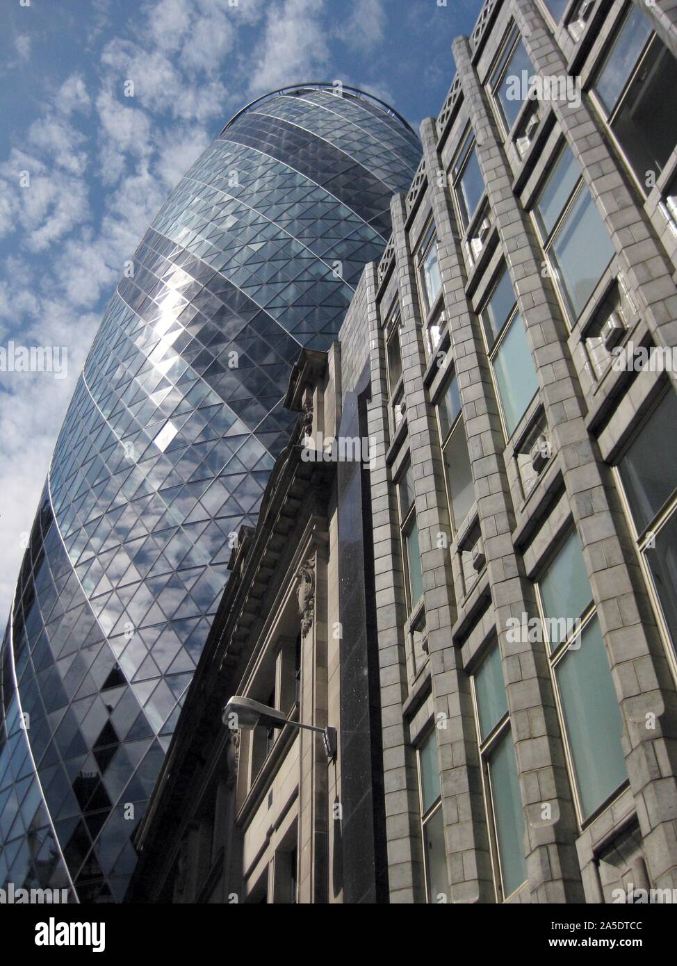 Low angle shot of a modern building with architectural twists under the ...