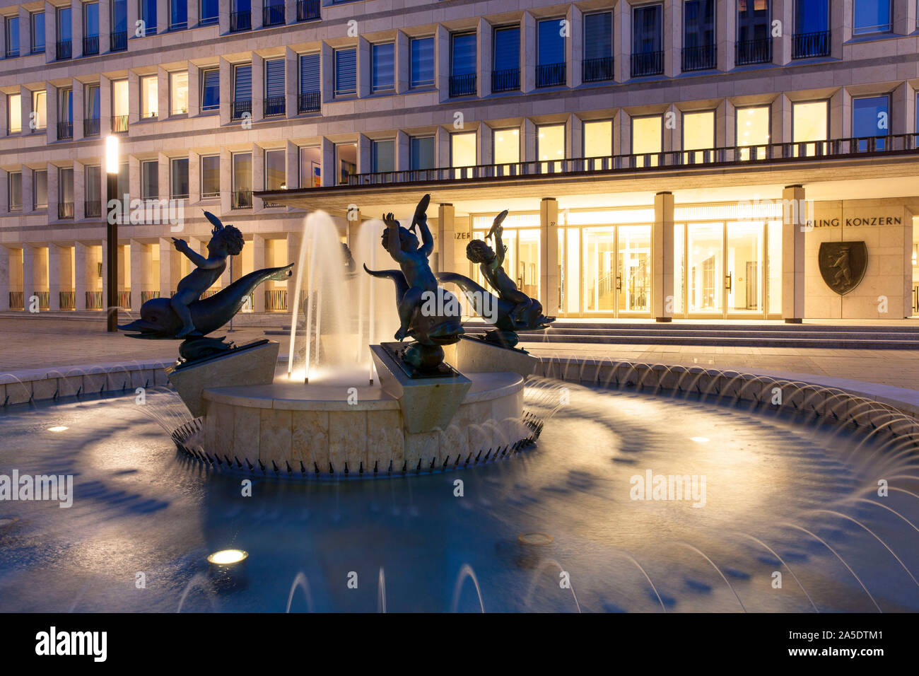 the Gerling Quartier, fountain with four boys riding on dolphins by ...