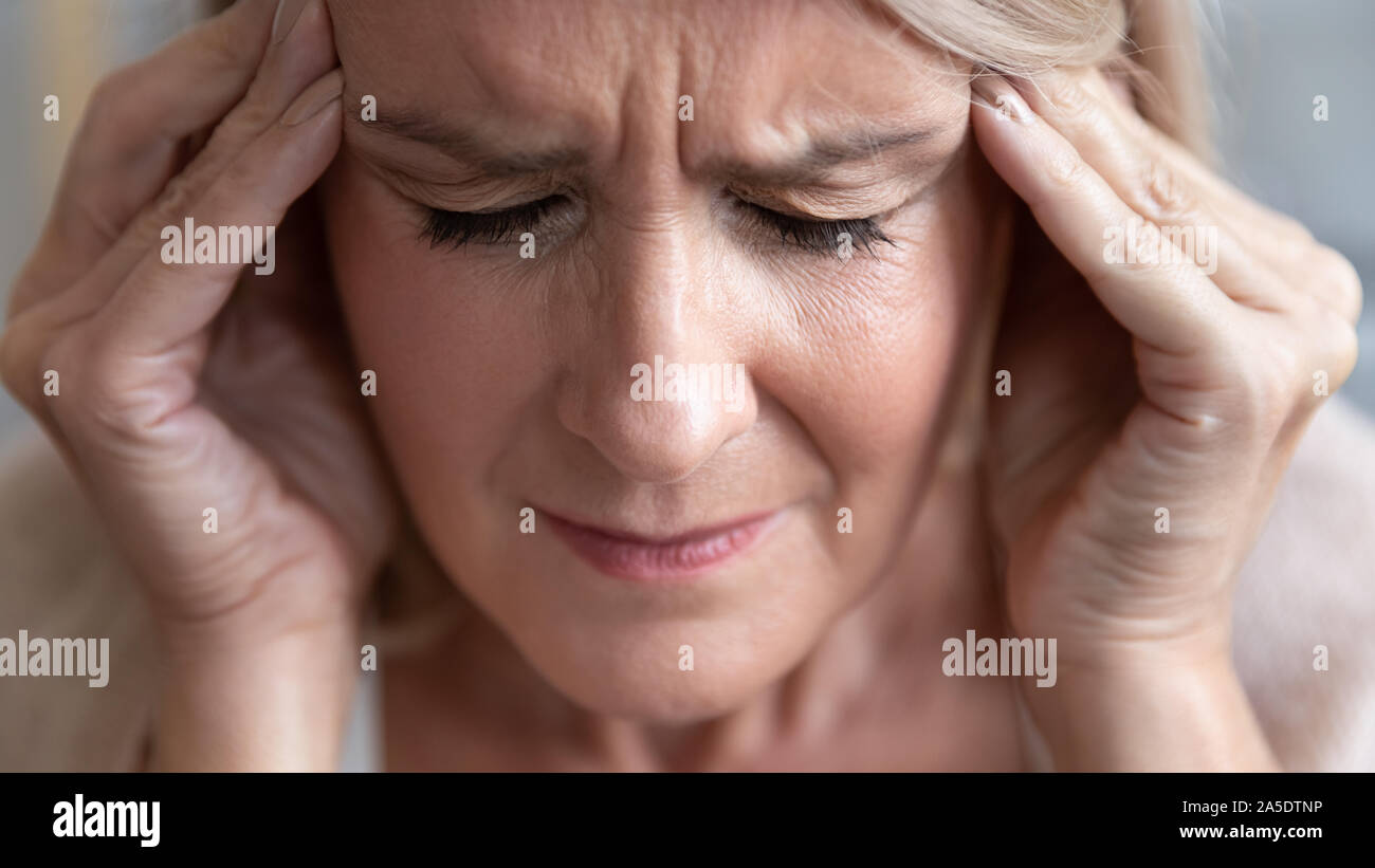 Woman hands to head blood hi-res stock photography and images - Alamy